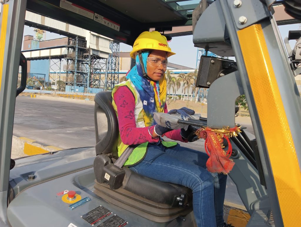 Woman operator driving electric forklift at Vedanta's Aluminium Smelter ...